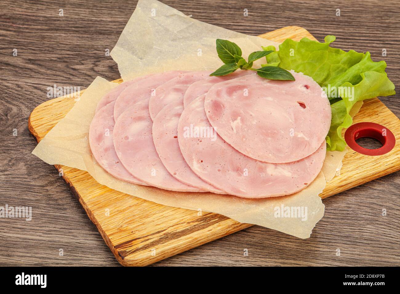 Slised ham pork snack over board Stock Photo - Alamy