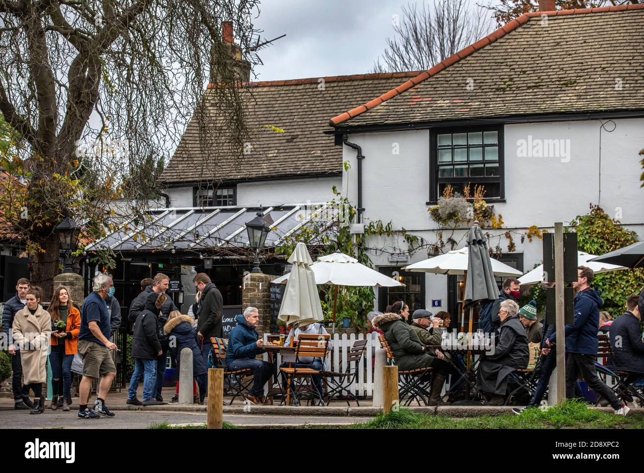 People enjoy the opportunity to sit outside together at the Hand In ...