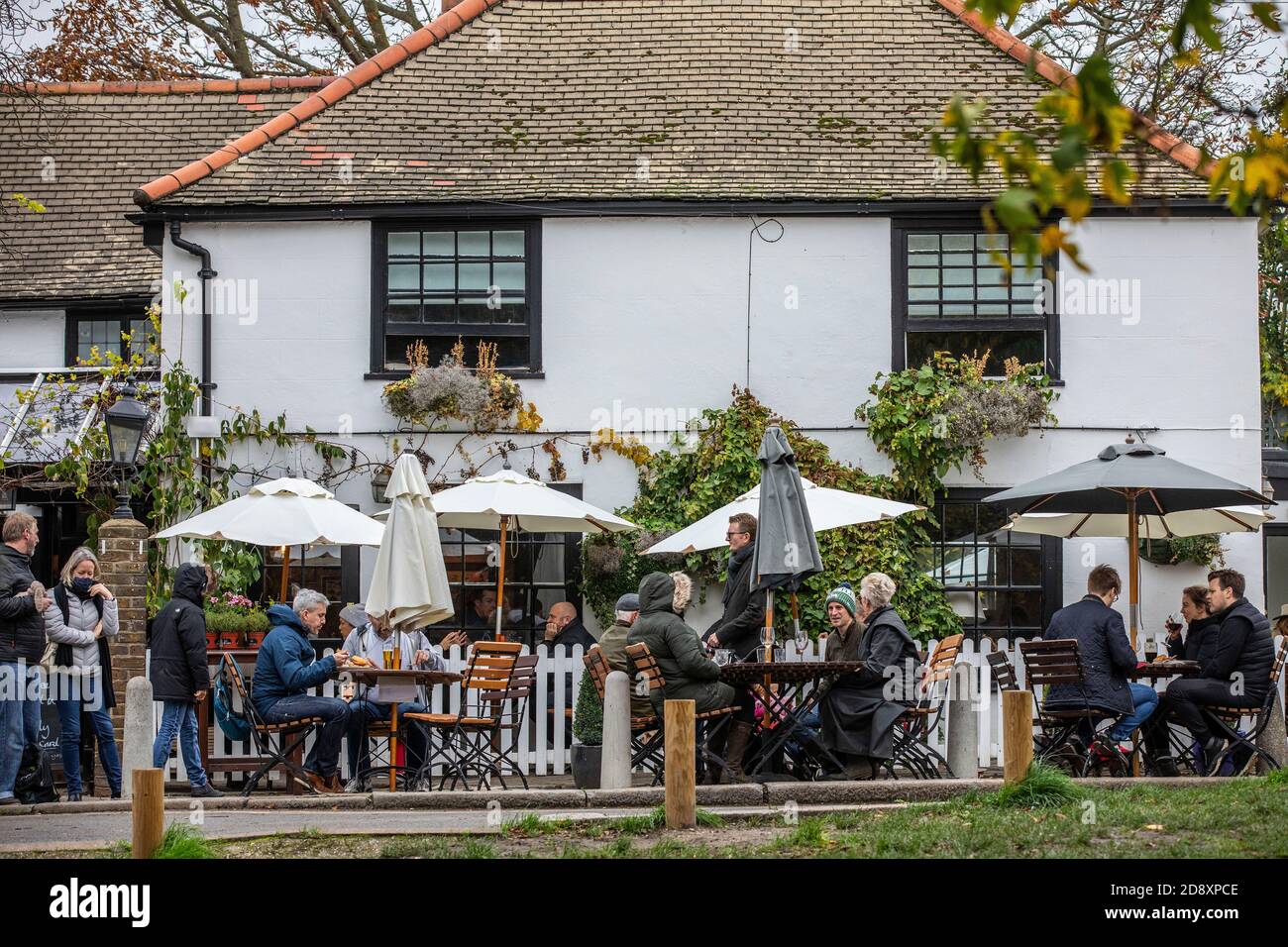 People enjoy the opportunity to sit outside together at the Hand In ...
