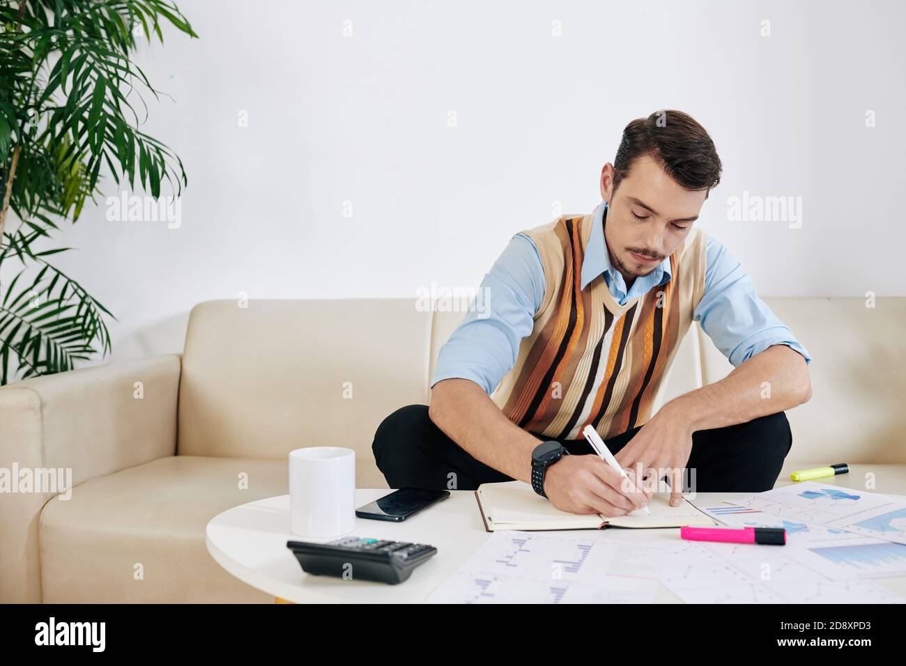 Concentrated male freelancer sitting desk hi-res stock photography and ...