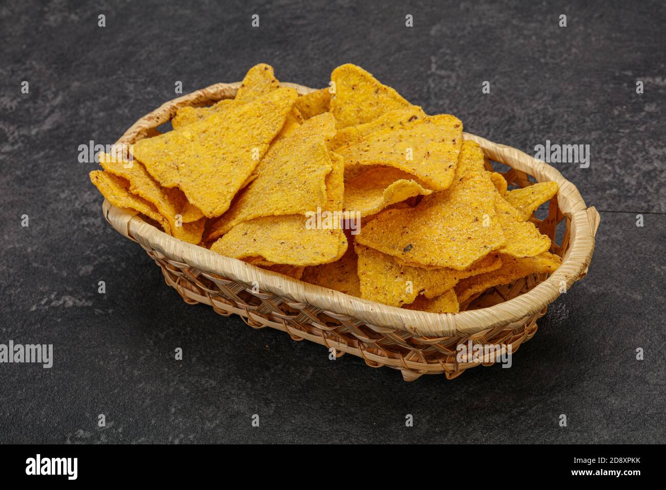 Mexican crunchy corn nachos triangle heap Stock Photo - Alamy