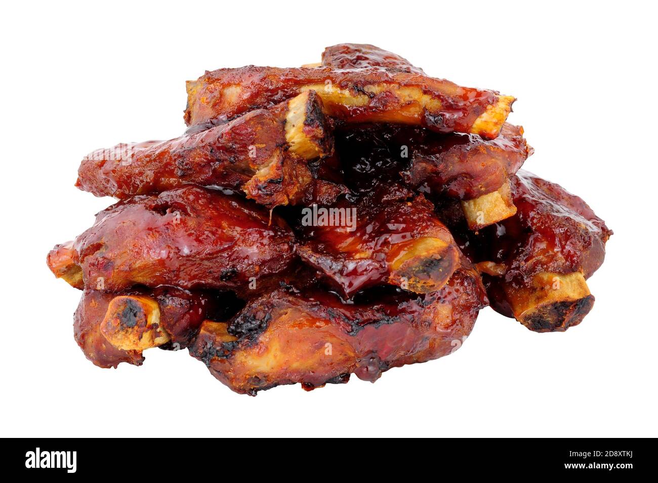 Group of mini pork ribs coated in sticky barbecue sauce isolated on a ...