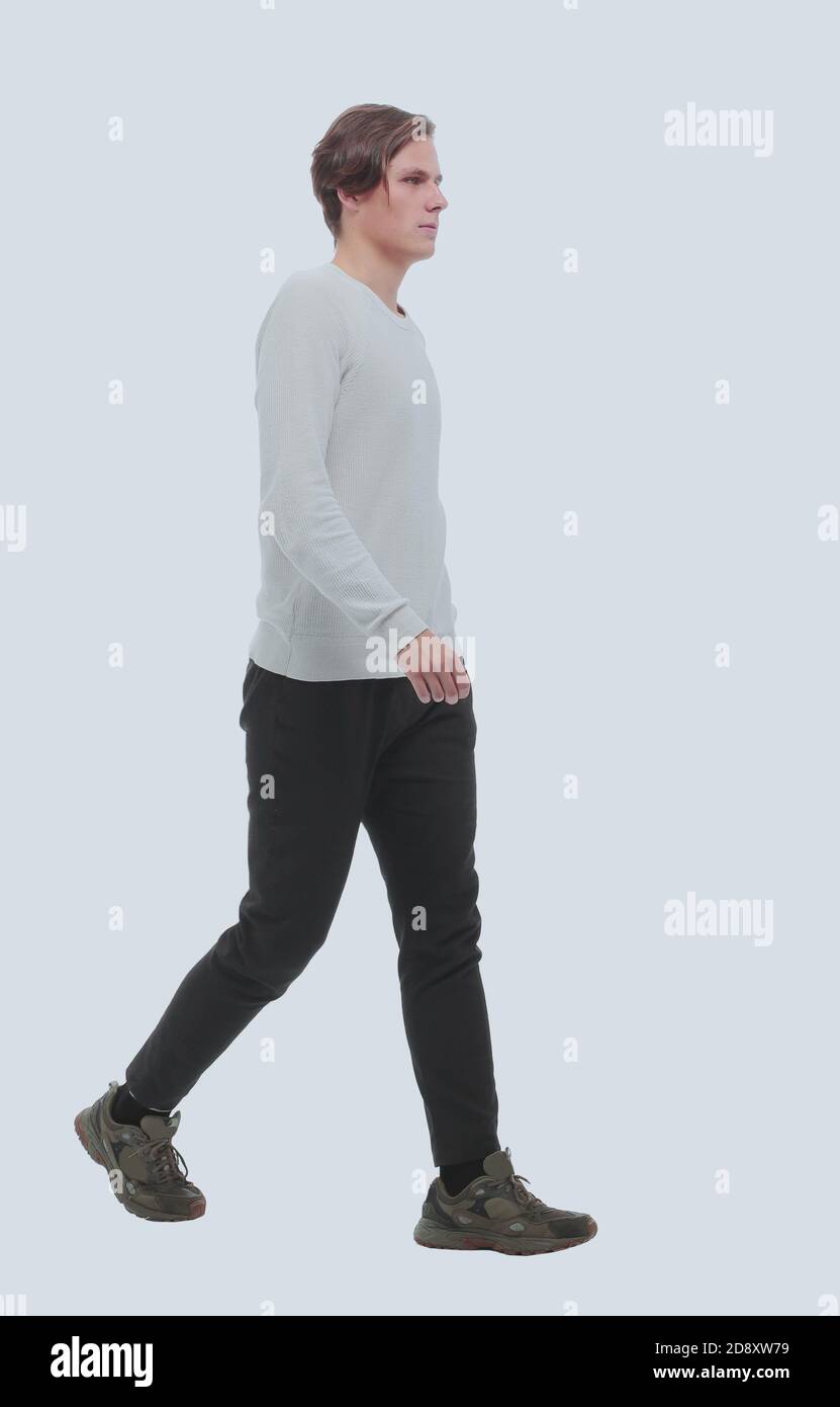 in full growth. confident young man striding forward Stock Photo - Alamy