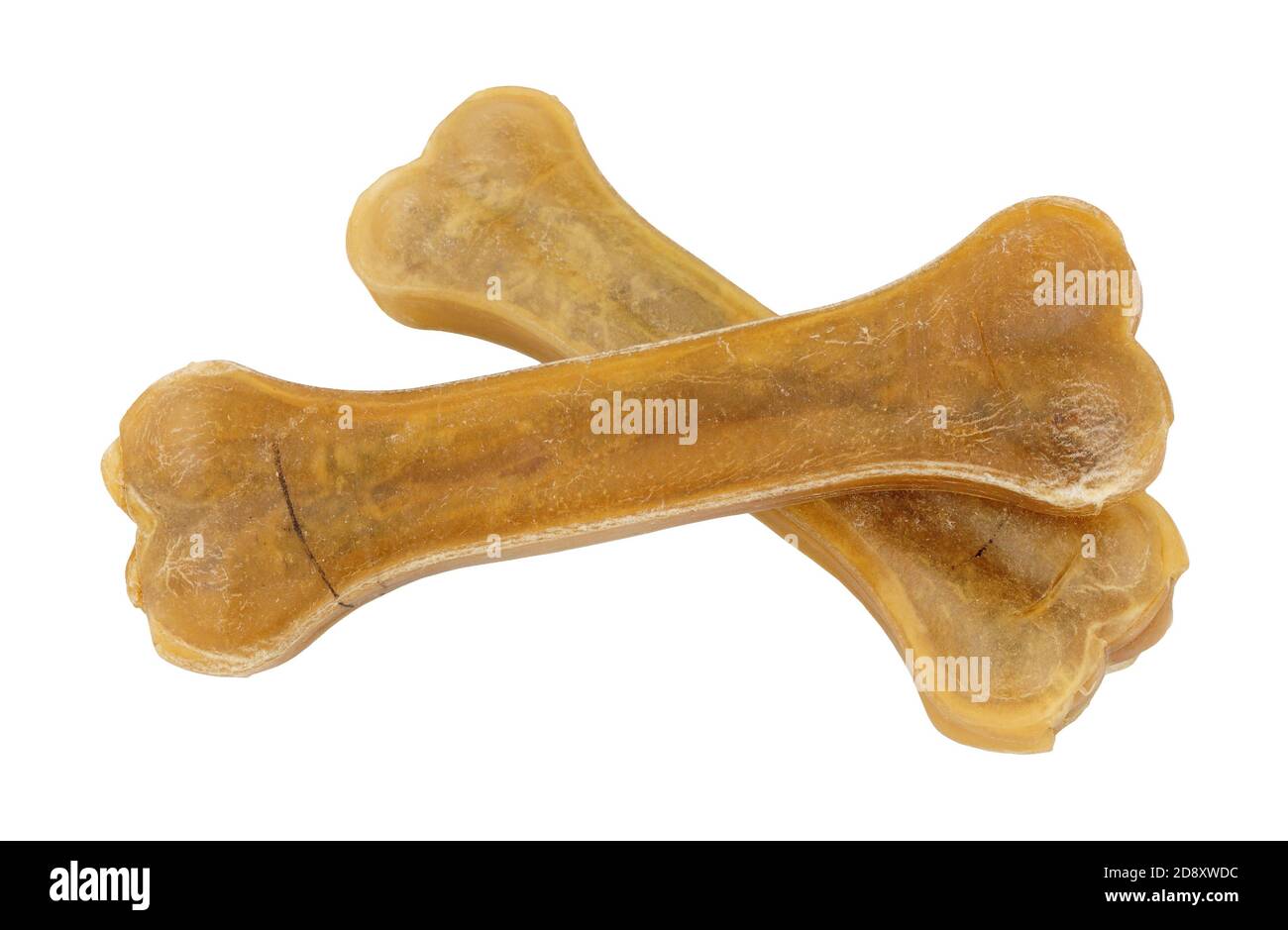 Pressed rawhide bone shaped dog chews isolated on a white background ...
