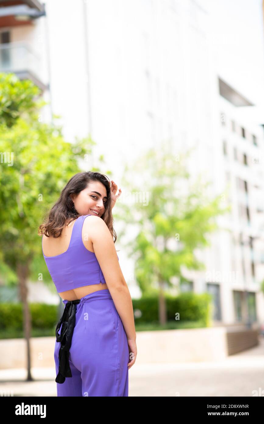 Women smiling looking over shoulder hi-res stock photography and images ...