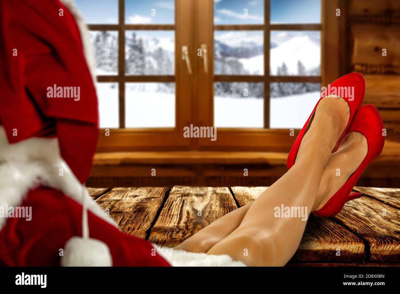 Santa Claus Woman's leg in red high heels on wooden table and window ...