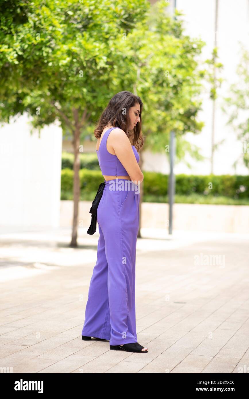 Sad woman standing outdoors Stock Photo - Alamy
