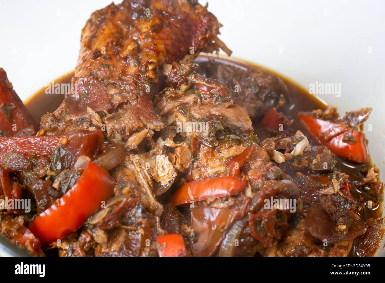 Freshly cooked Jamaican Brown Stew Fish Stock Photo - Alamy