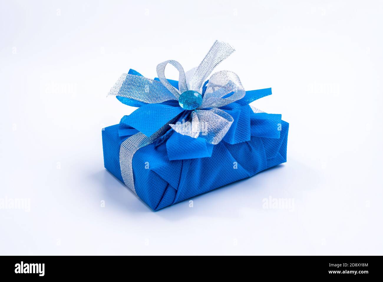 Classic blue surprise gift box with blue and white ribbon, background ...