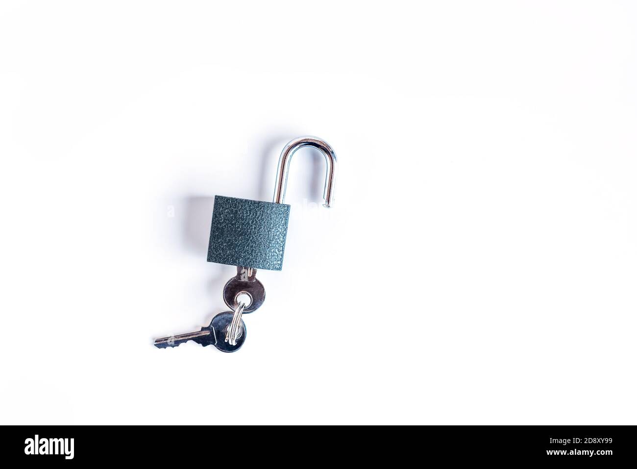 Lock and keys. Closeup of opened metal padlock with key inside isolated ...