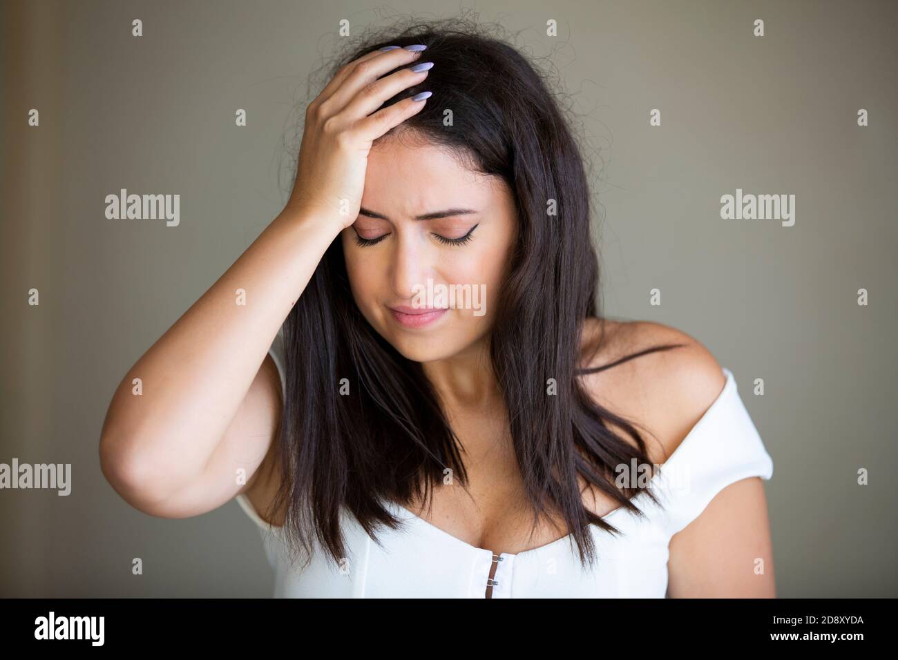 Stressed woman hand on head Stock Photo - Alamy