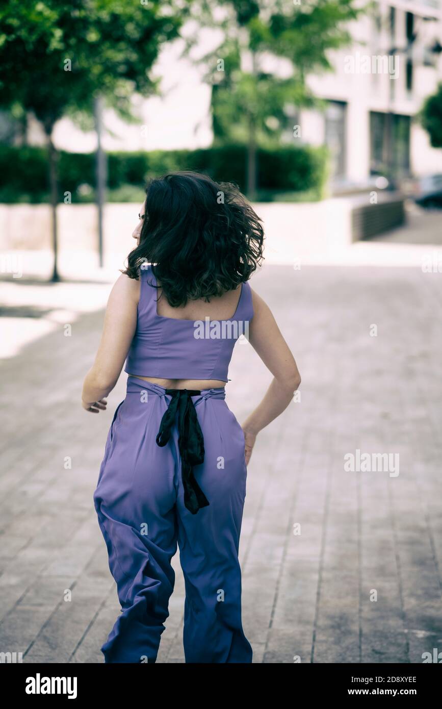 Dark hair girl running away hi-res stock photography and images - Alamy