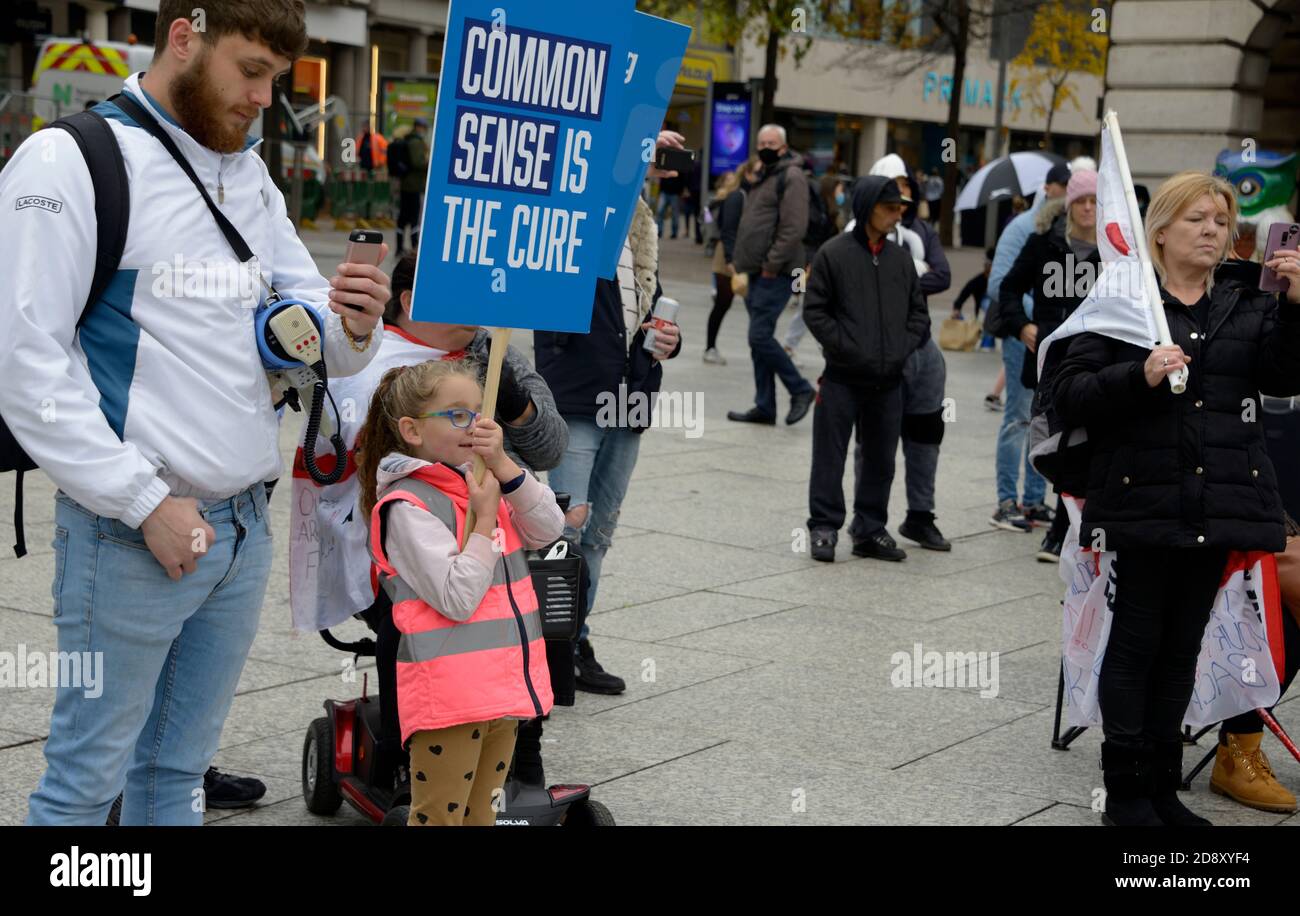 People at conspiracy theory gathering with placards Stock Photo - Alamy