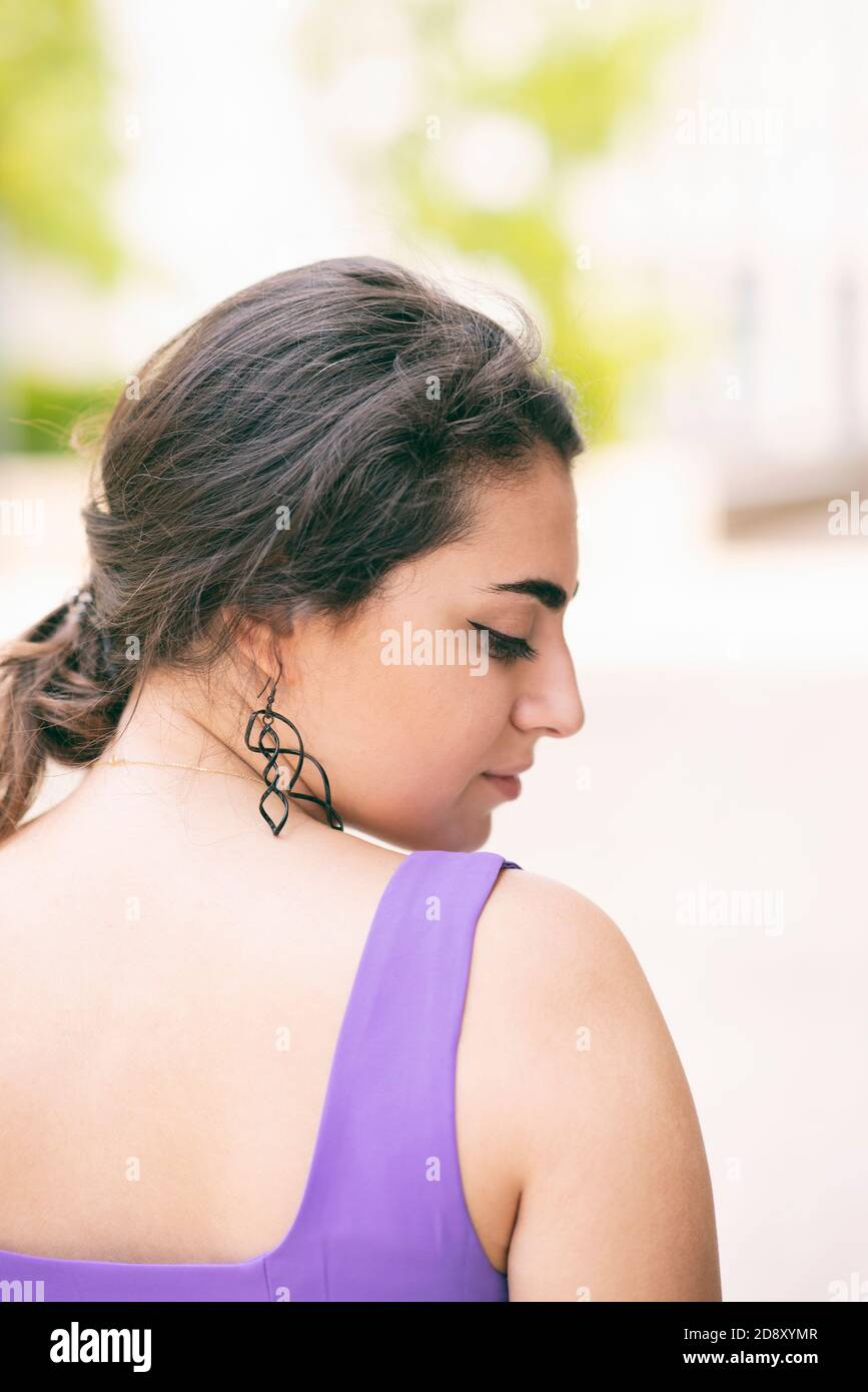 Woman back over shoulder dark hi-res stock photography and images - Alamy