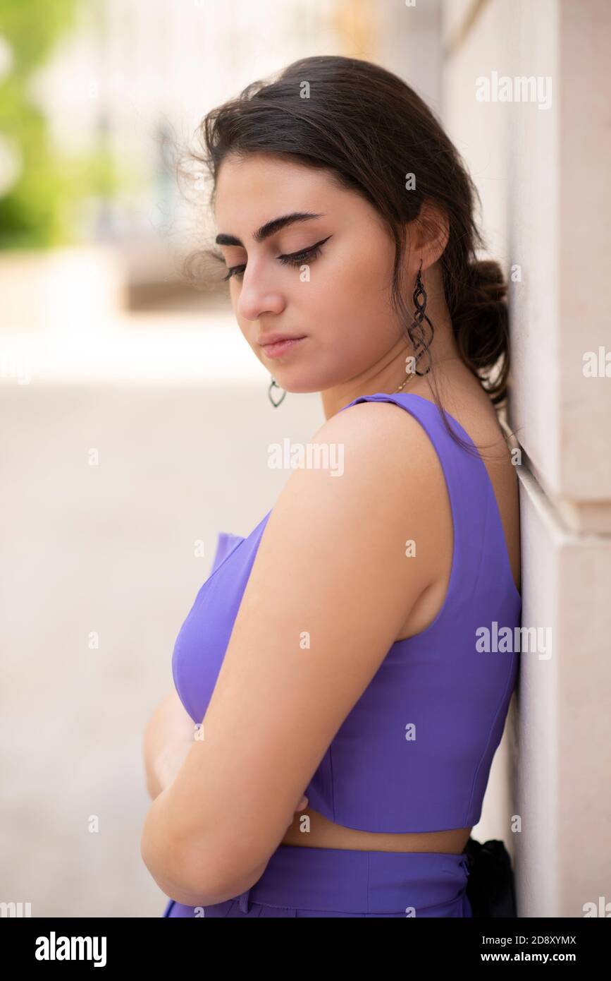 Sad woman looking down outdoors Stock Photo - Alamy