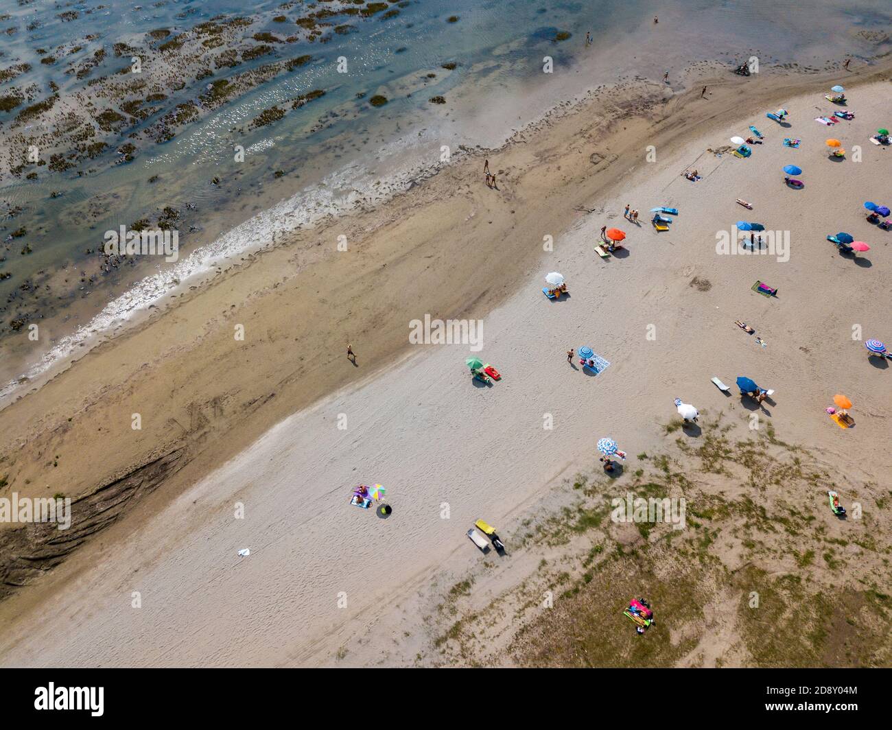 Aerial view of unidentifiable people enjoying summer at the beach of ...