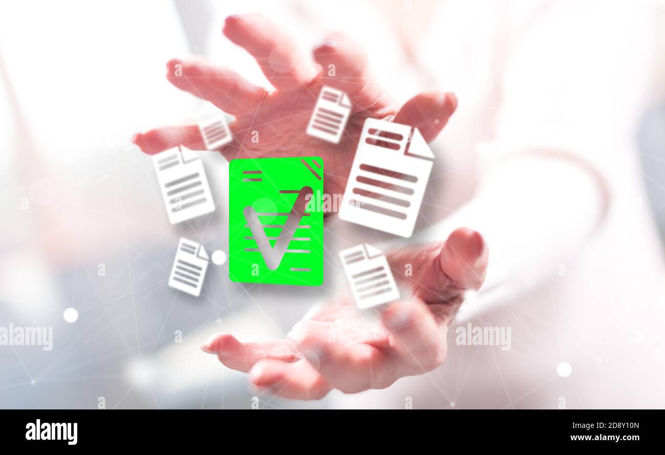 Document validation concept between hands of a woman in background ...