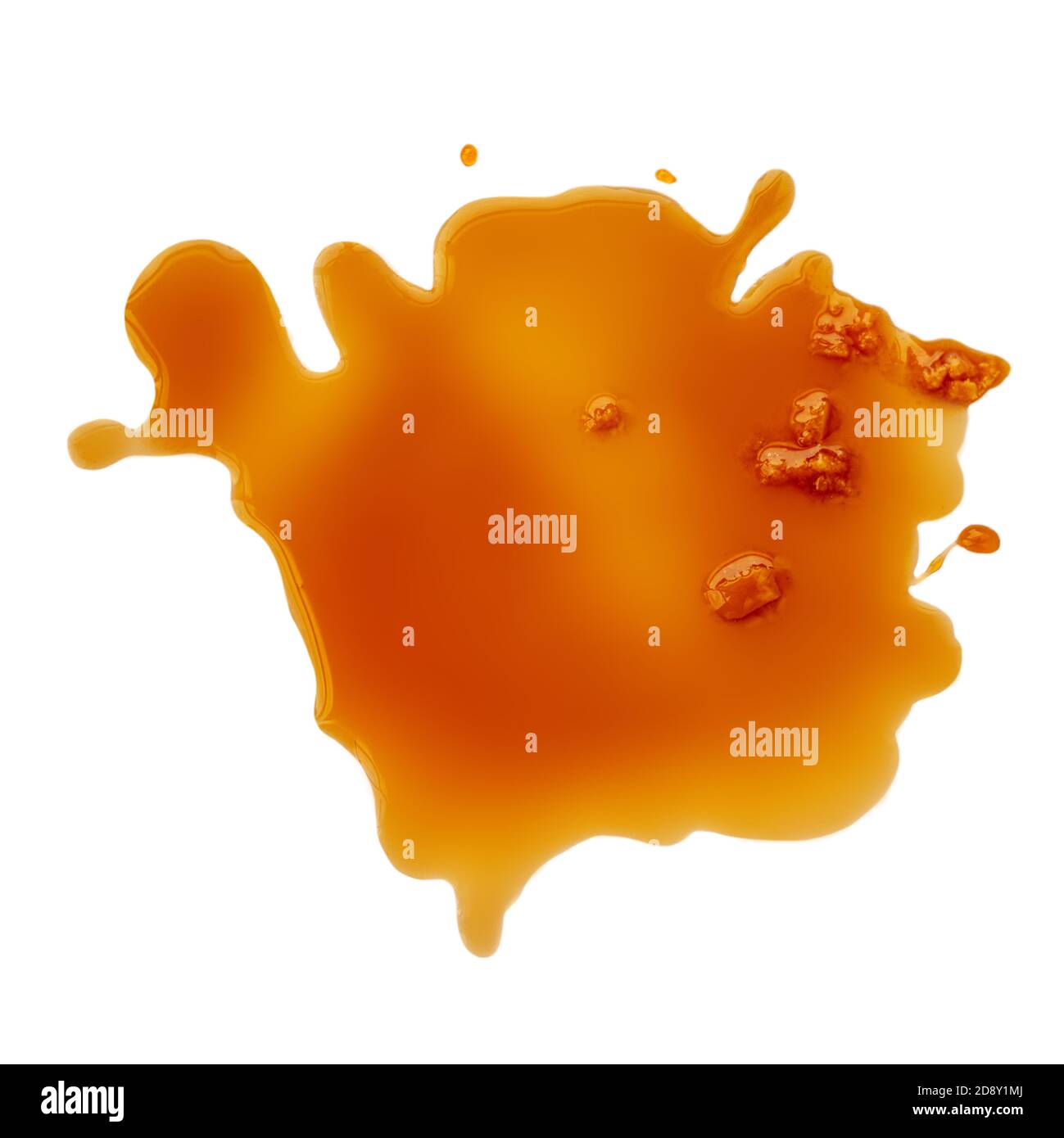 Caramel splashes isolated on white background. Spilled caramel sauce ...