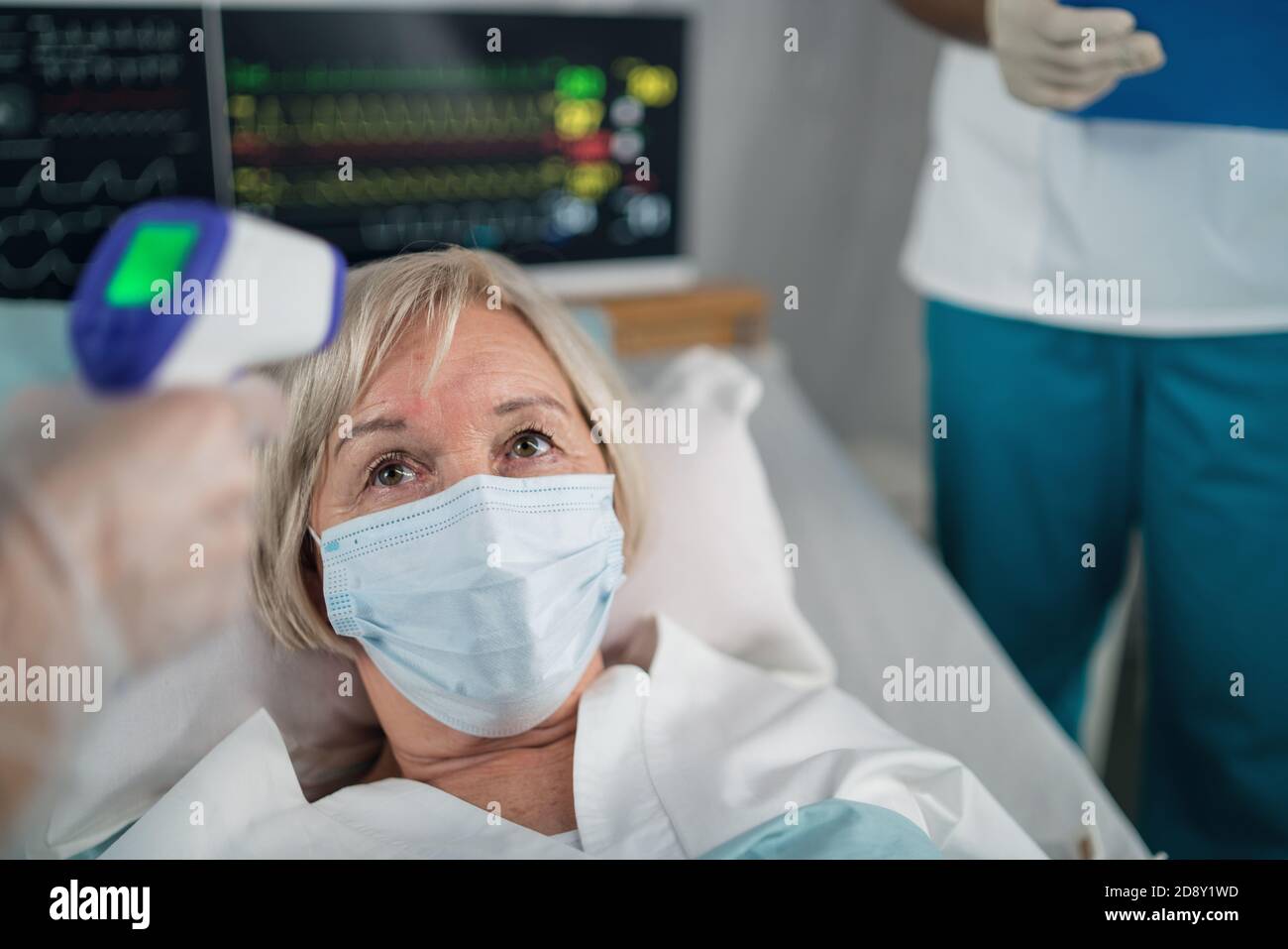 Doctor and covid-19 infected patient in bed in hospital, coronavirus ...