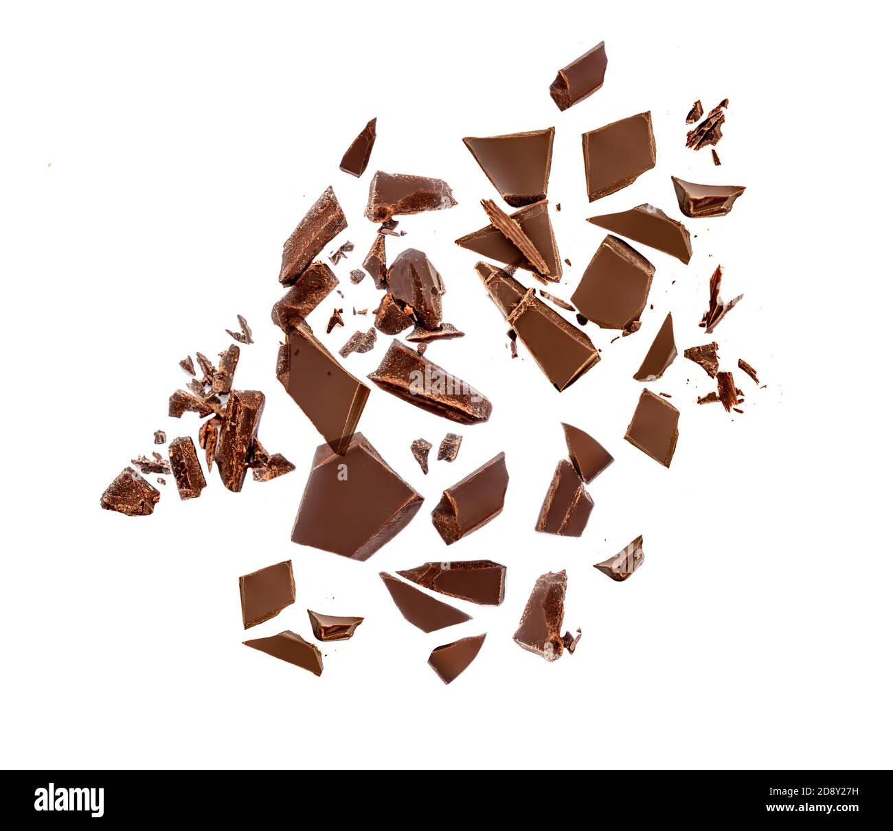 Chocolate pieces and shavings isolated on white background. Chunks of dark chocolate falling ...
