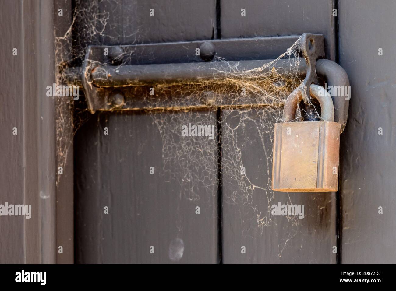 Cobwebs show this Business has been locked and bolted or a long time ...