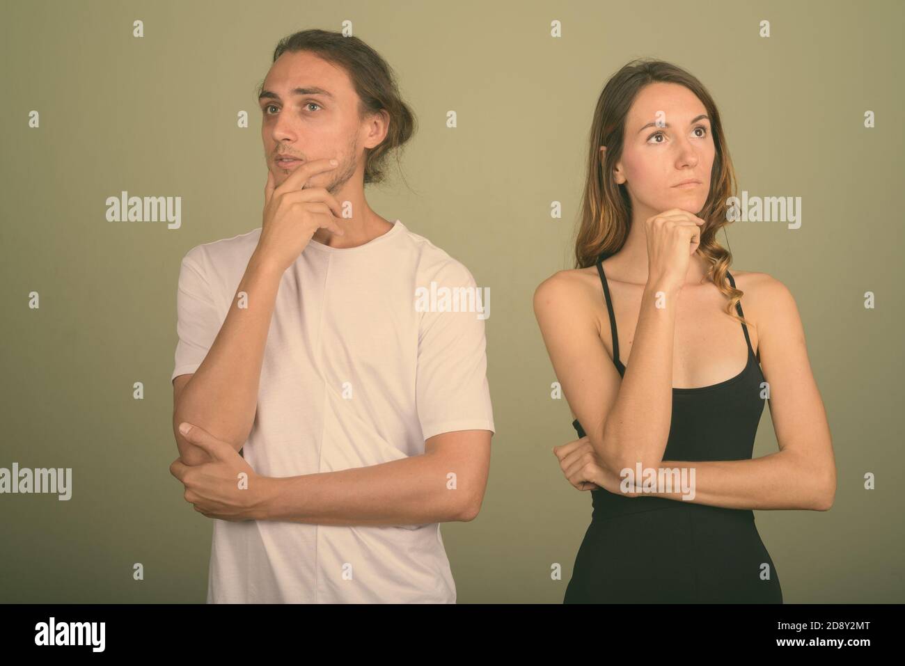 Young handsome man and young beautiful woman together against colored ...