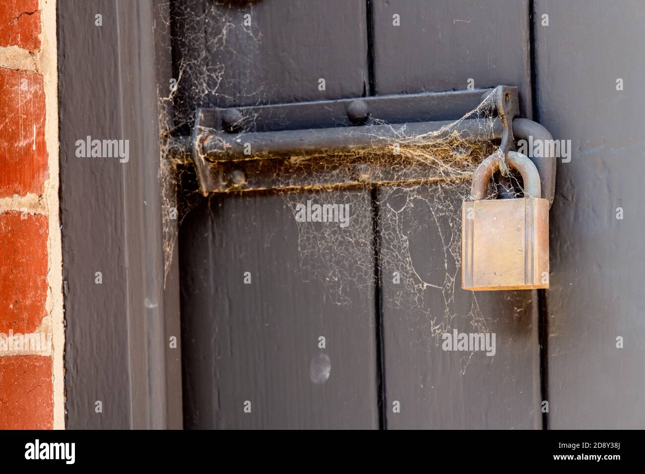Cobwebs show this Business has been locked and bolted or a long time ...
