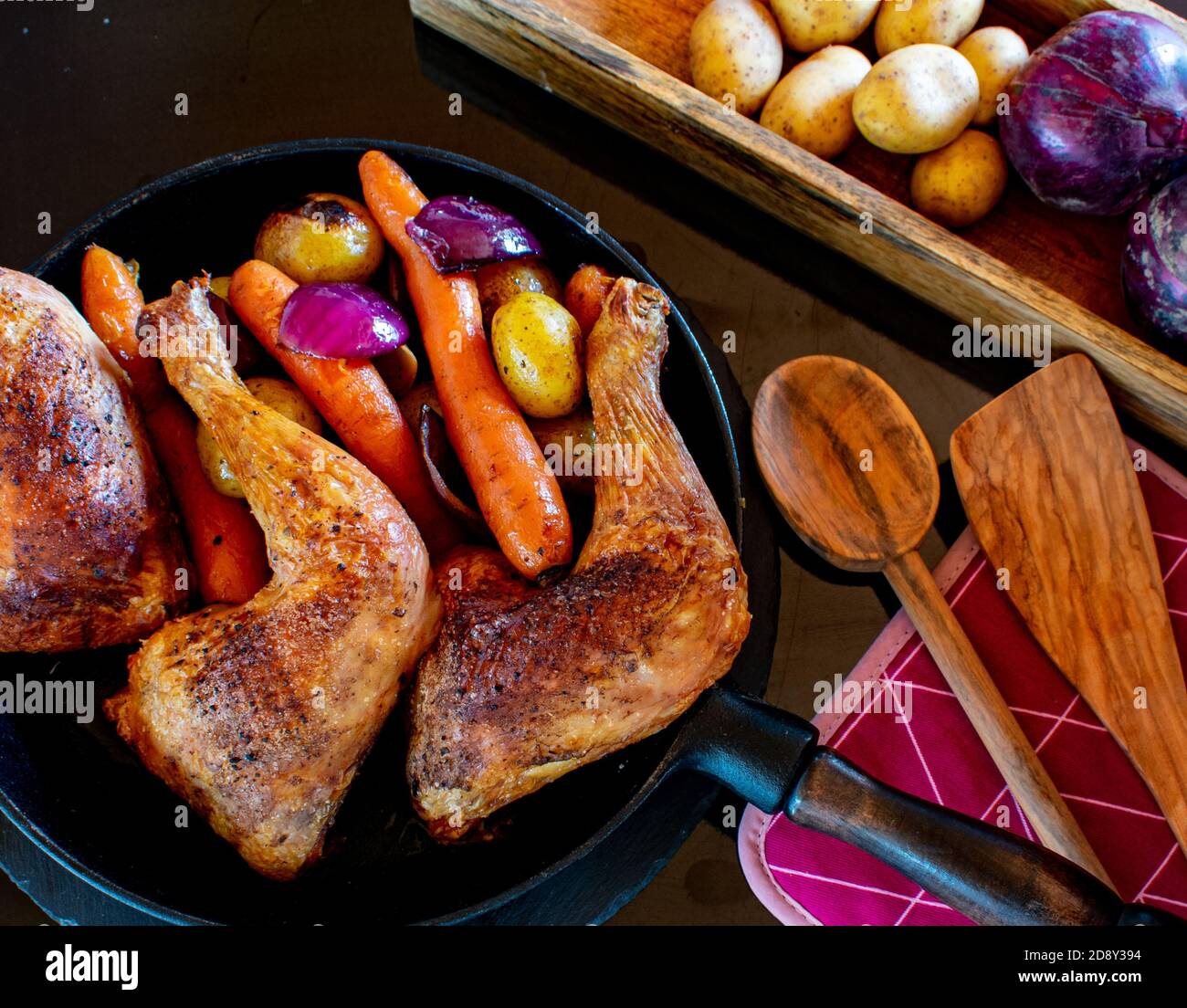 homemade cooked meal with roast chicken and vegetables in a pan from ...