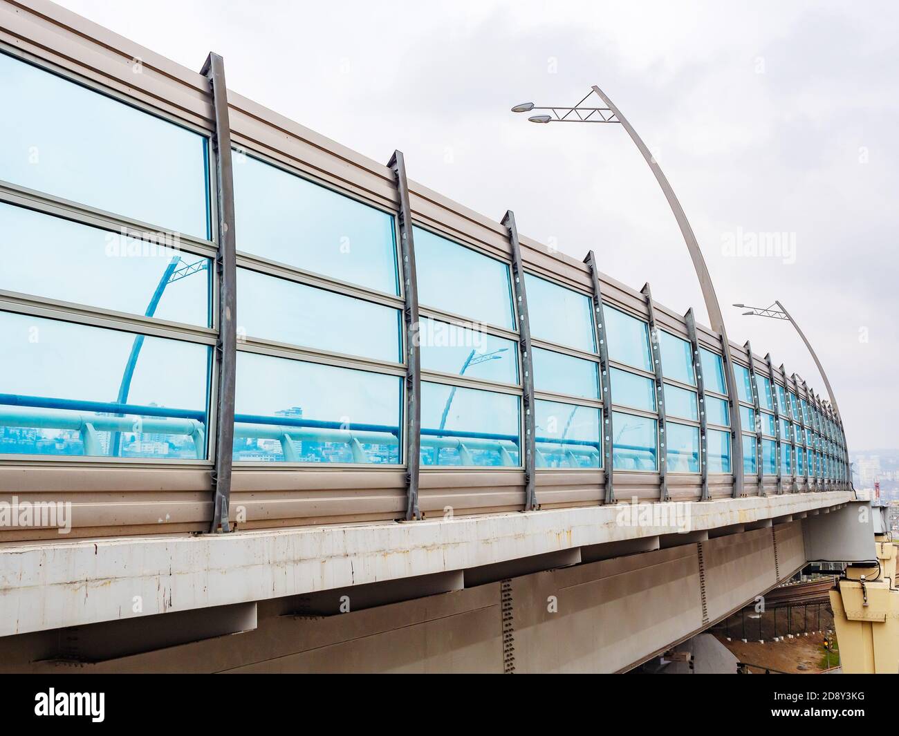 Modern transport overhead bridge with a blue transparent fence Stock ...