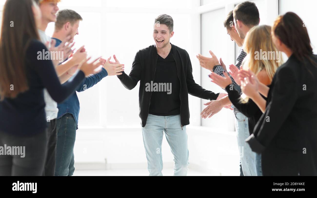 Business team congratulating leader hi-res stock photography and images ...