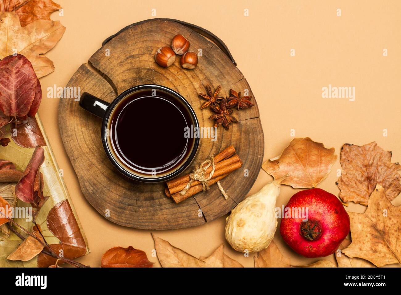 A cup of coffee on a tree trunk slice in a top view Stock Photo - Alamy