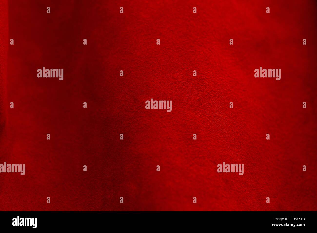Red matte background of suede fabric, closeup. Velvet texture of ...