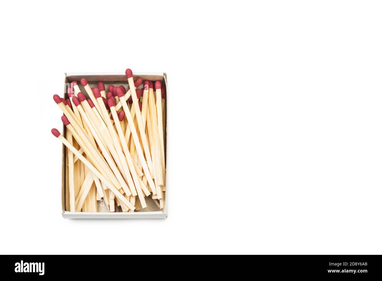 Wooden matches sticks with red head in a match box on a white ...