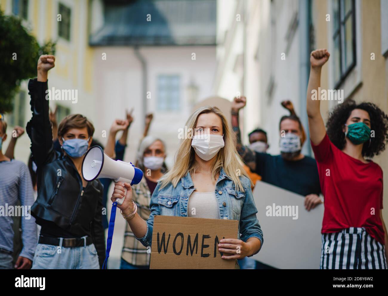 Group of people activists protesting on streets, women march and ...