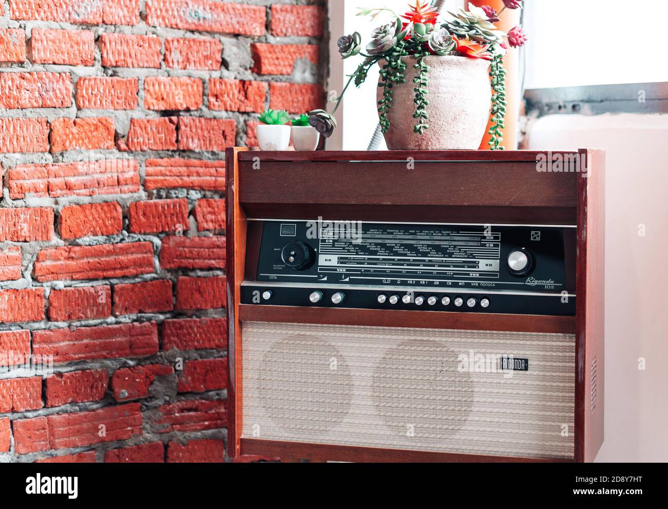 retro transistor radio receiver against brick wall Stock Photo - Alamy