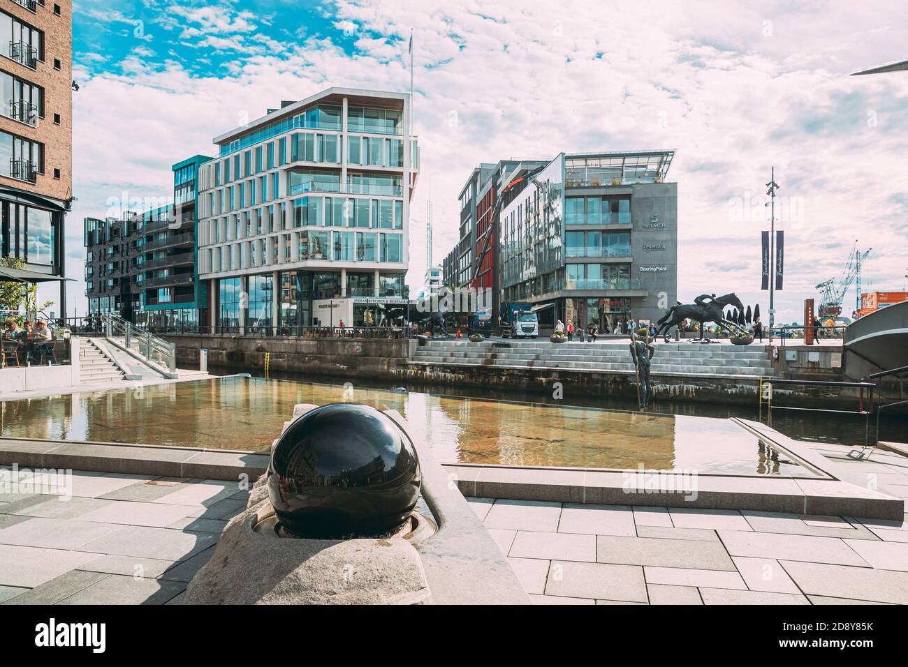 Oslo, Norway. People Walking Near Residential Multi-storey Houses In ...
