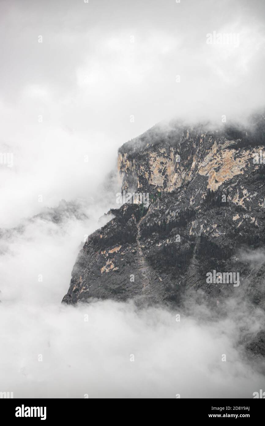 swiss mountains in the clouds, foggy weather in Switzerland Stock Photo ...