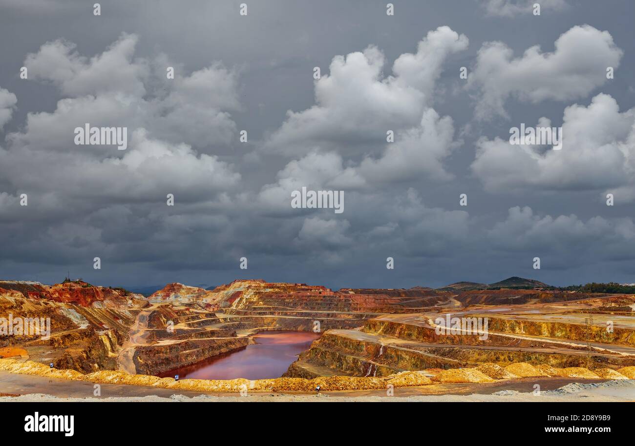 Copper mine under the dark cloudscape, wide angle Stock Photo - Alamy
