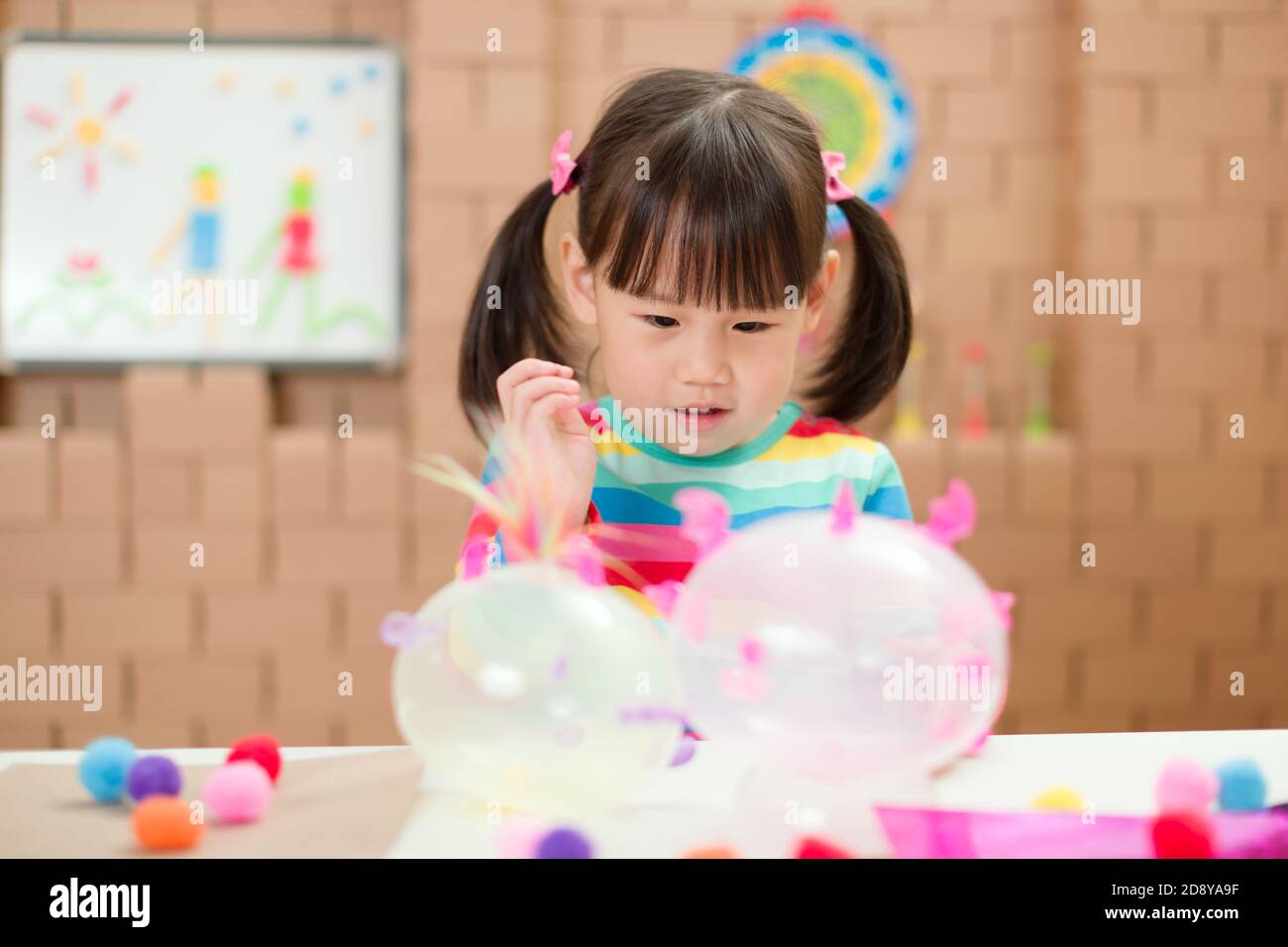 young girl making craft for homeschooling Stock Photo - Alamy