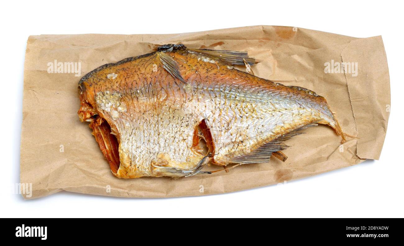 Long-cooked fish. Baked in a Russian oven on straw. Isolated Stock ...
