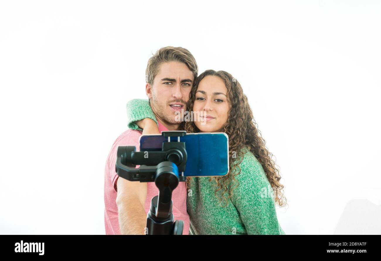 Couple making a selfie and recording a video with a gimbal Stock Photo ...