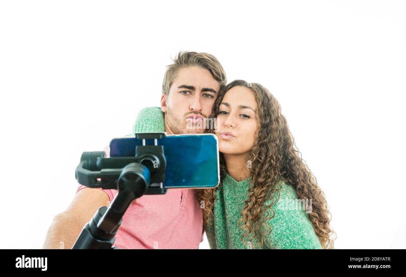 Couple making a selfie and recording a video with a gimbal Stock Photo ...