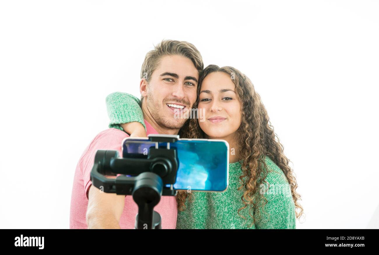 Couple making a selfie and recording a video with a gimbal Stock Photo ...