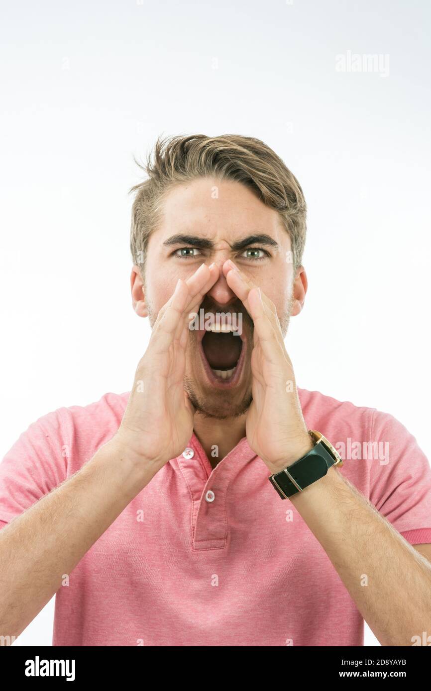Portrait of very angry young people on a white background Stock Photo ...