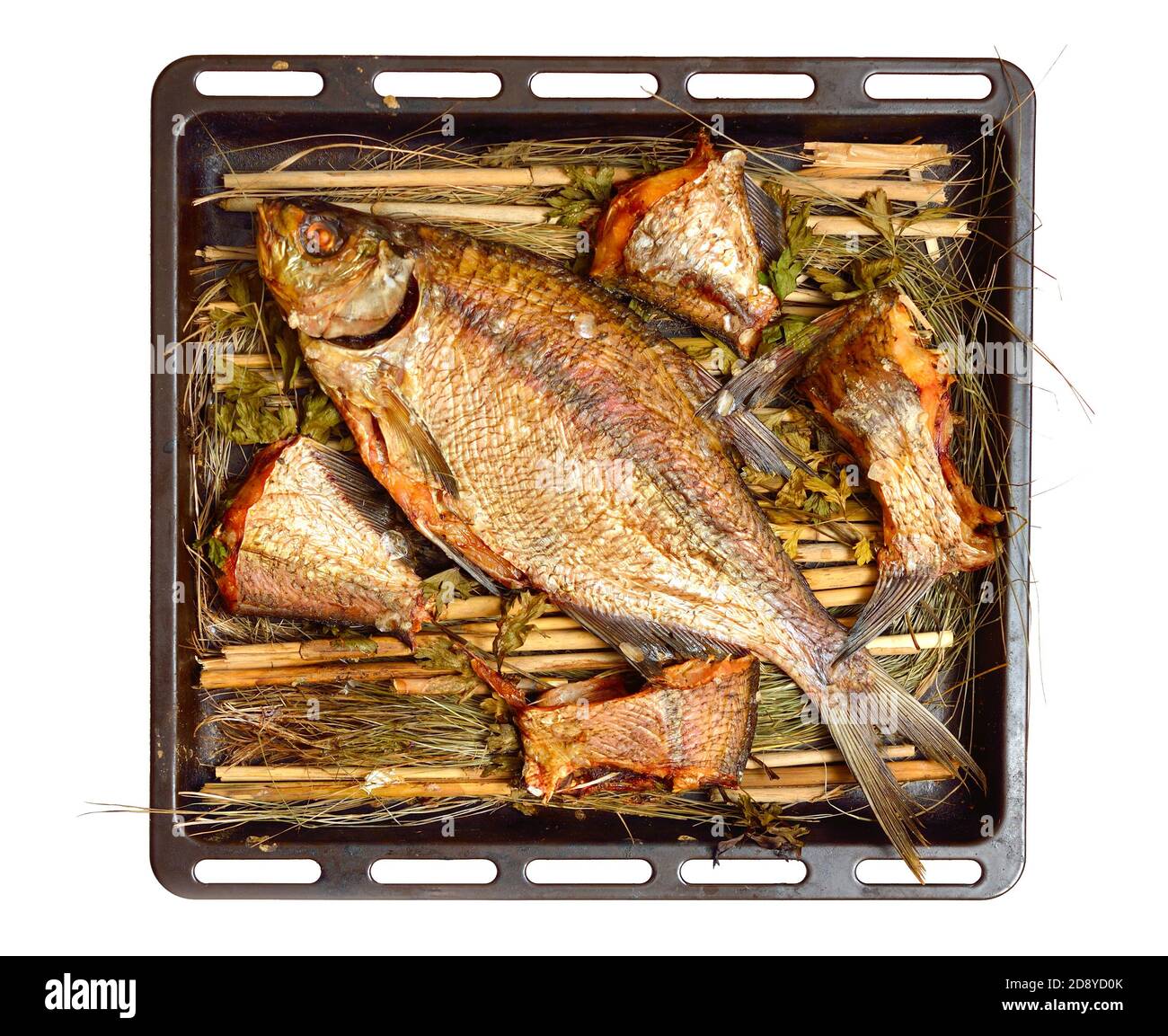 Long-cooked fish. Baked in a Russian oven on straw. Isolated Stock ...
