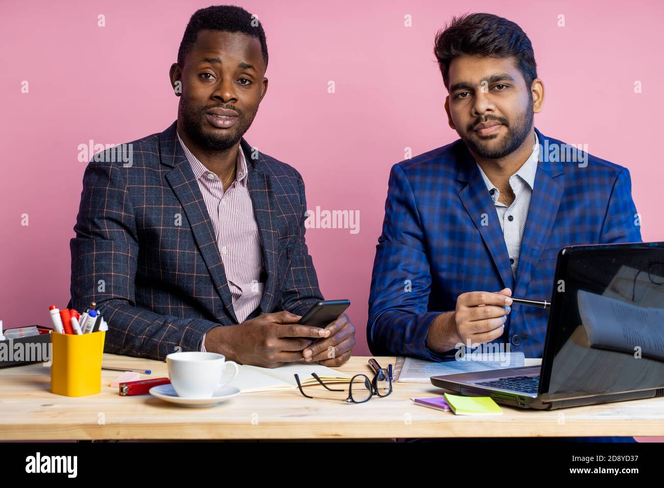 Two men at table in suits hi-res stock photography and images - Alamy