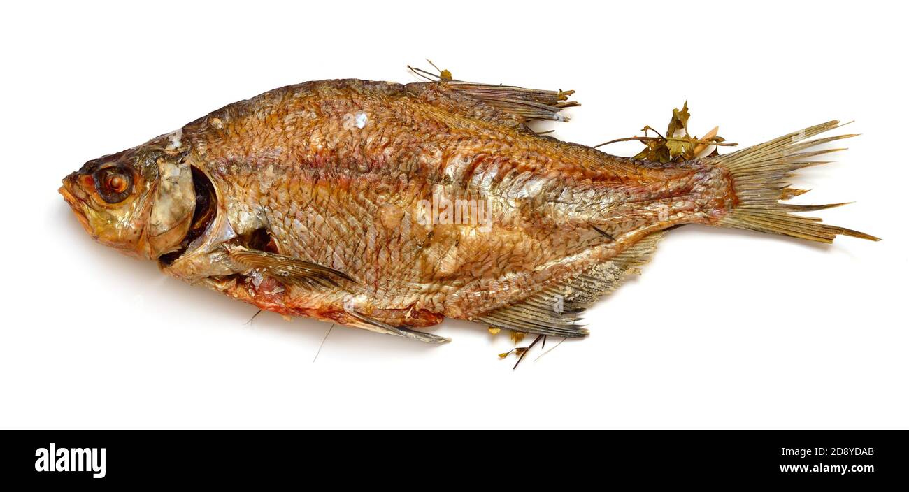 Long-cooked fish. Baked in a Russian oven on straw. Isolated Stock ...