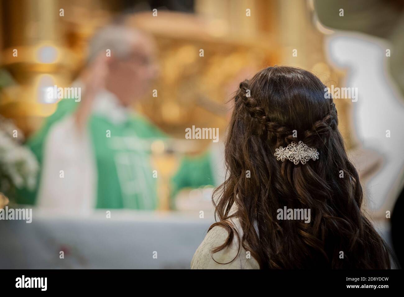 a catholic priest saying a mass on the altar of a church Stock Photo ...