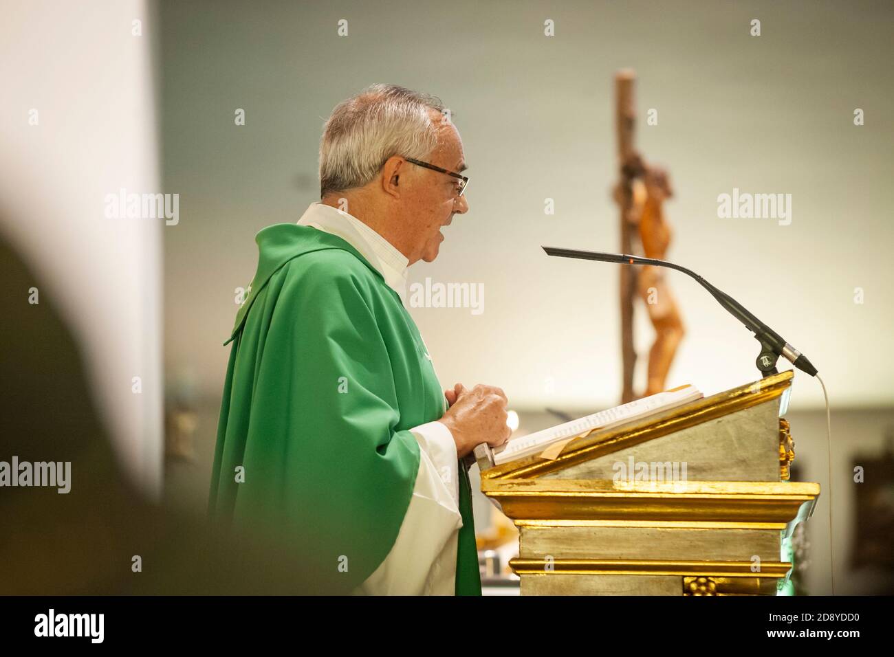 a catholic priest saying a mass on the altar of a church Stock Photo ...