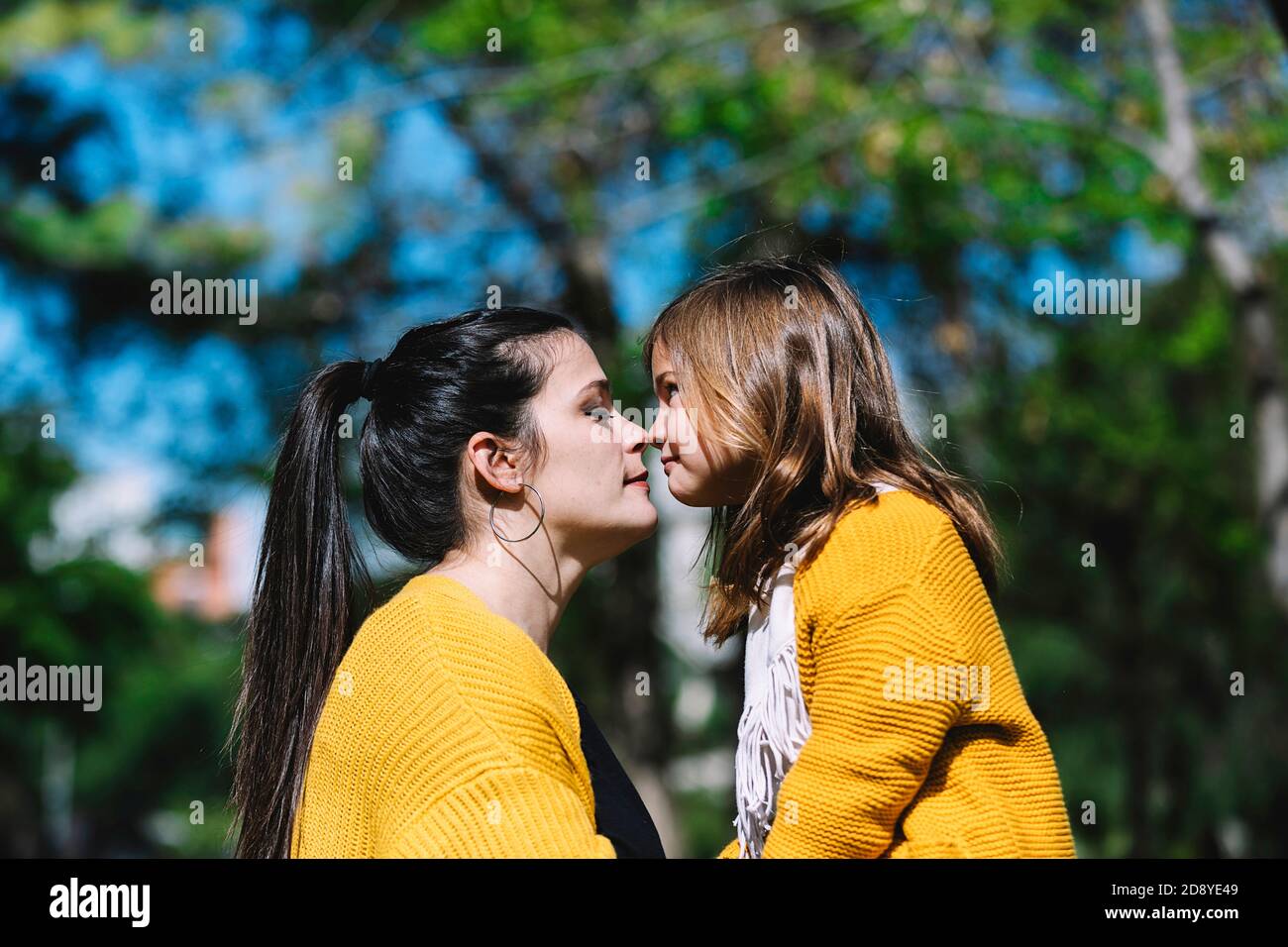 Little cute child baby girl kiss on cheek and hug, embrace with happy ...